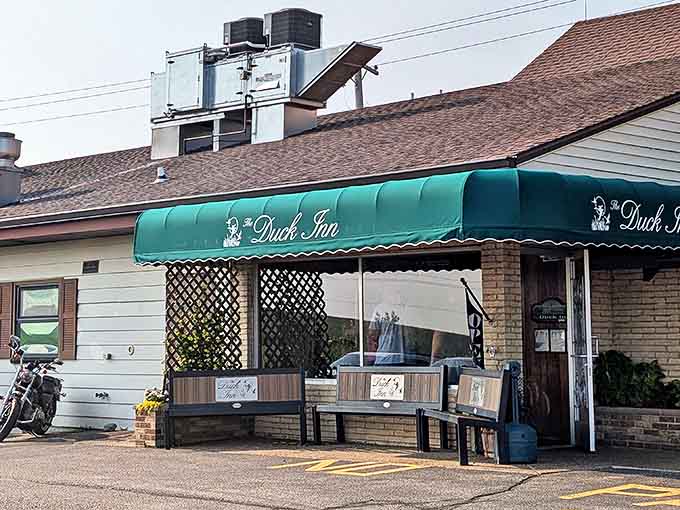 The green awning beckons like an old friend, promising comfort food and conversation in equal measure at this beloved Delavan institution.