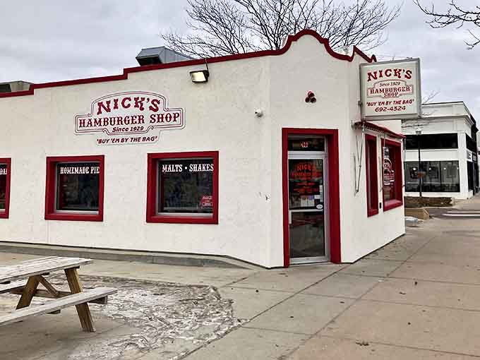 The iconic white building with red trim stands like a time capsule on Brookings' Main Avenue, beckoning burger lovers since 1929.