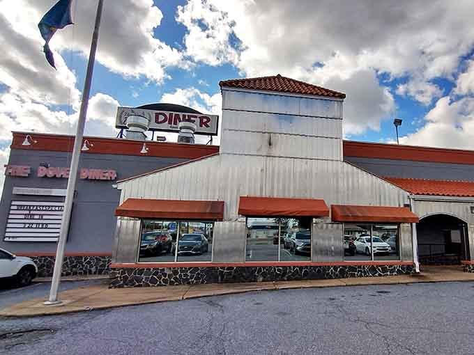 The Dove Diner's exterior promises comfort before you even step inside, with its classic stone foundation and welcoming awnings beckoning hungry travelers like a culinary lighthouse.