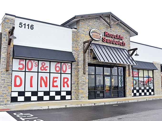 The stone facade and bold "50's & 60's DINER" signage isn't just inviting&mdash;it's practically a time portal waiting to whisk you back to simpler days.