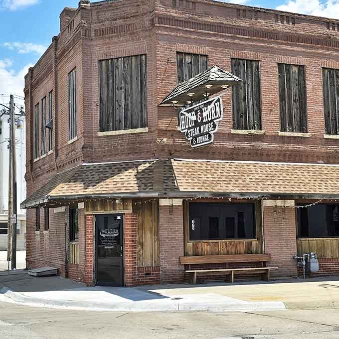 The historic brick exterior of Hoof & Horn stands proudly on the corner, like a time capsule of Midwestern culinary tradition waiting to be opened.