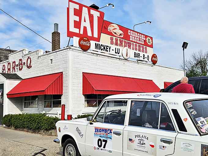 The iconic Mickey-Lu Bar-B-Q sign has been beckoning hungry travelers since the 1940s. That "EAT" command isn't a suggestion—it's the best advice you'll get all day.