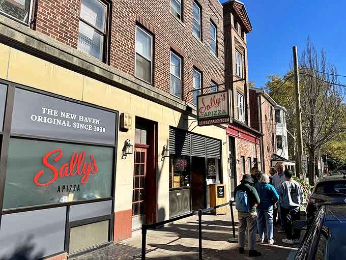 The unassuming brick facade of Sally's Apizza hides New Haven's pizza royalty. Like finding Narnia in a wardrobe, but with better snacks.