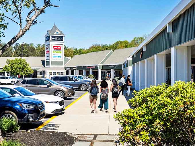 The iconic tower of Kittery Premium Outlets stands like a retail lighthouse, guiding bargain hunters safely to shore through seas of full-price merchandise.