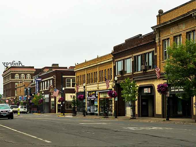 Howard Street's historic brick facades tell stories spanning generations, where American flags flutter above storefronts that have witnessed a century of Iron Range life.