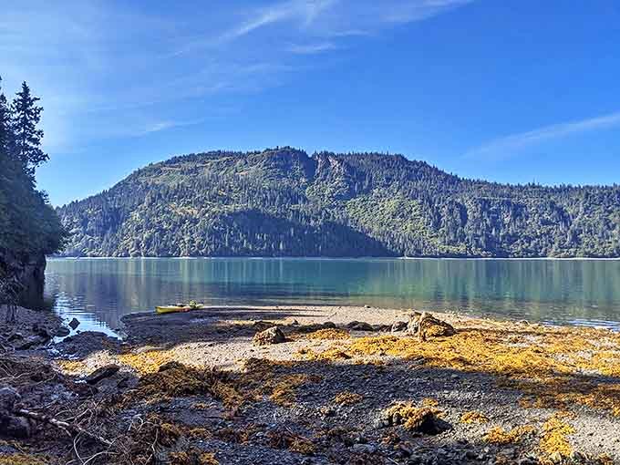 Nature's mirror game is undefeated at Grewingk Glacier Lake, where mountains preen at their reflections like celebrities checking their Instagram posts.