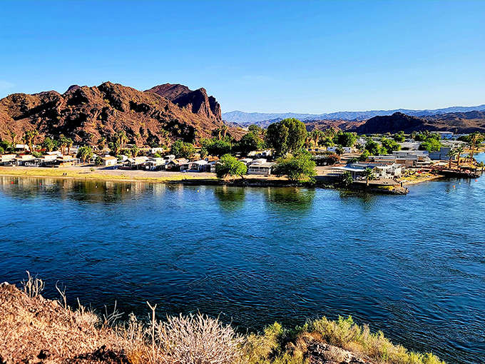 Where rugged mountains meet tranquil waters, River Island State Park creates nature's perfect contradiction. Desert peaks reflect in the Colorado River's blue mirror.