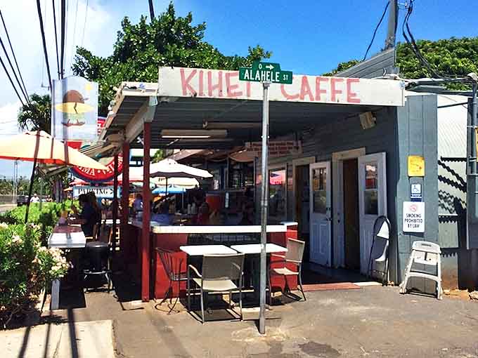 The unassuming exterior of Kihei Caffe might fool you, but that line of hungry patrons tells the real story. Paradise awaits under those red umbrellas.