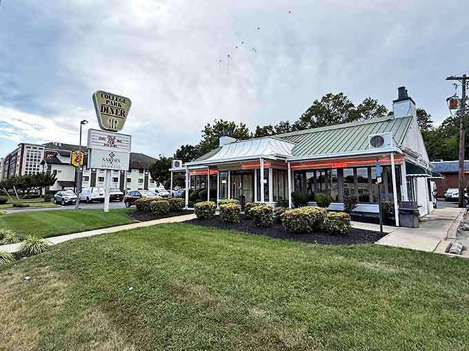 The classic silver-topped diner stands like a time capsule against the Maryland sky, promising comfort food and zero pretension.