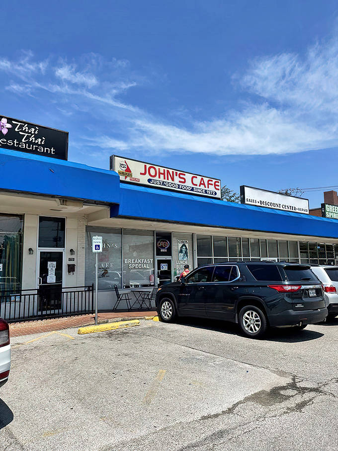 The blue awning of John's Cafe stands out like a beacon of hope for hungry travelers. "Just good food since 1973" isn't marketing&mdash;it's a promise kept.
