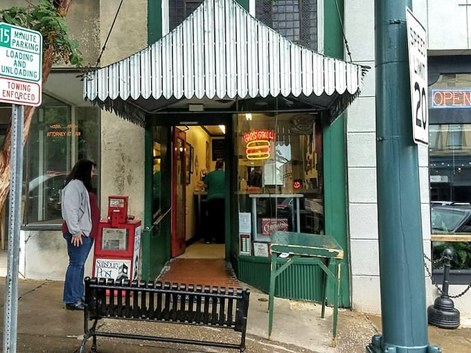 The iconic green storefront with its vintage striped awning beckons hungry visitors like a beacon of burger bliss in downtown Salisbury.