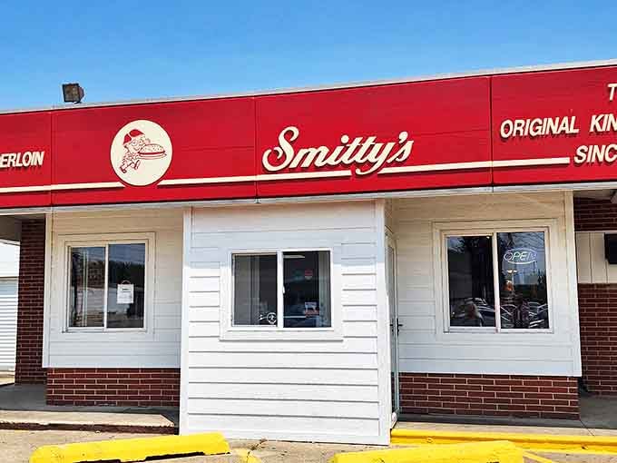 The distinctive red signage of Smitty's has become a beacon for tenderloin lovers, promising authentic Iowa flavor in every bite.