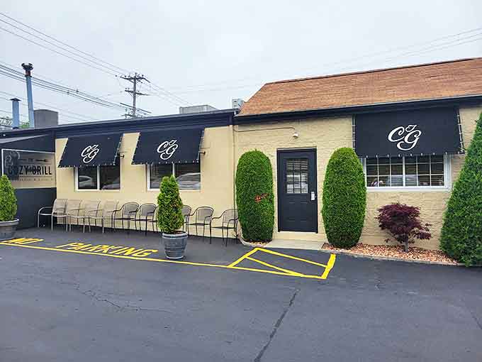 The unassuming exterior of The Cozy Grill proves once again that culinary treasures often hide in plain sight. Those black awnings might as well be waving "come hungry, leave happy" flags.