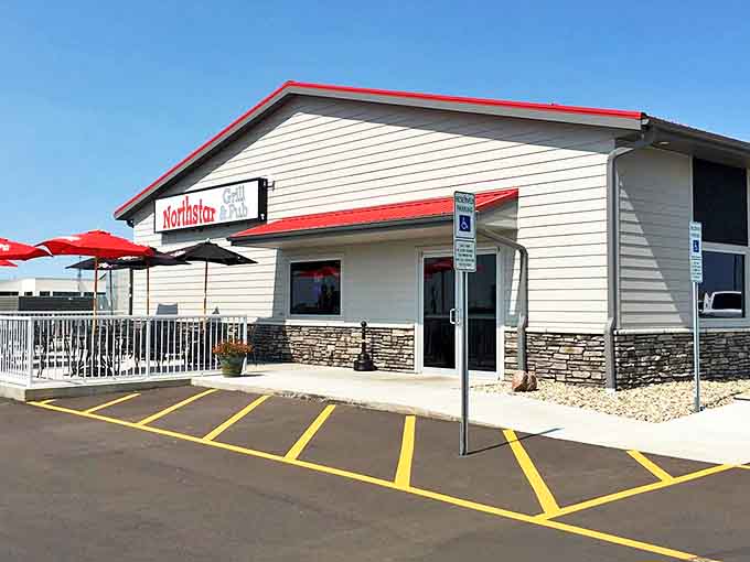 The unassuming exterior of Tinners Public House North might fool you, but those red umbrellas are practically semaphore flags signaling "deliciousness ahead!"