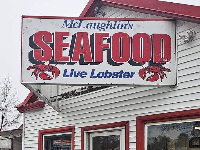 The iconic McLaughlin's sign promises exactly what Maine visitors crave: fresh seafood and live lobster, no frills necessary.