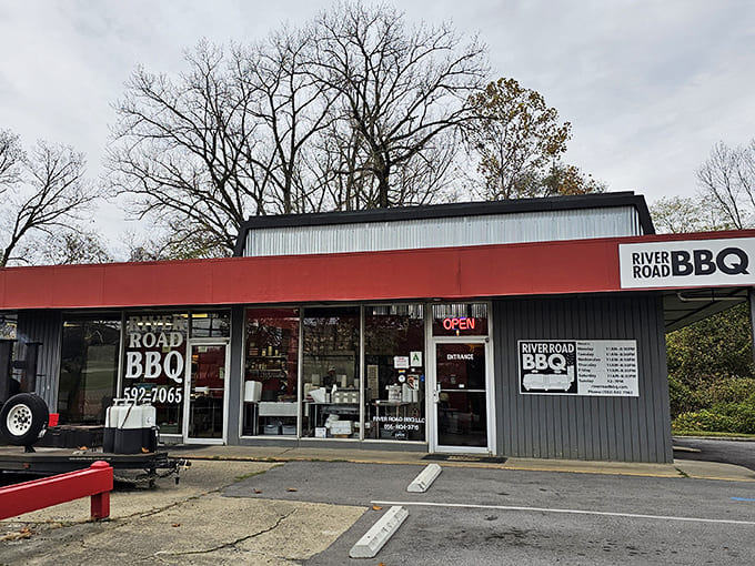 The distinctive red and gray facade of River Road BBQ stands as a beacon for brisket enthusiasts seeking authentic Kentucky barbecue.