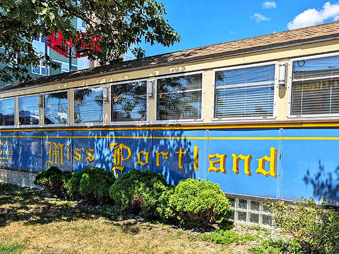 The diner's distinctive silhouette against a perfect Maine sky. Some architectural styles go out of fashion; this one just gets more beautiful with age.