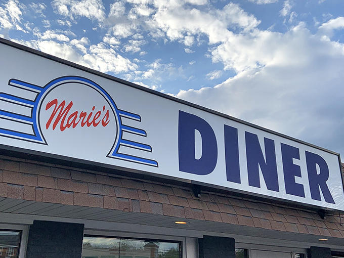 The iconic Marie's Diner sign stands proudly against Maryland skies, beckoning hungry travelers to breakfast nirvana.
