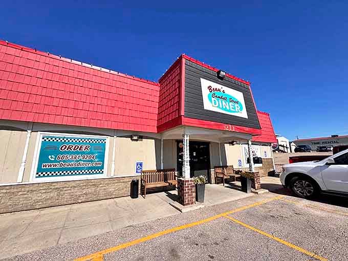 The bright red roof of Beau's Diner stands out like a beacon of breakfast hope along Rapid City's roadside.