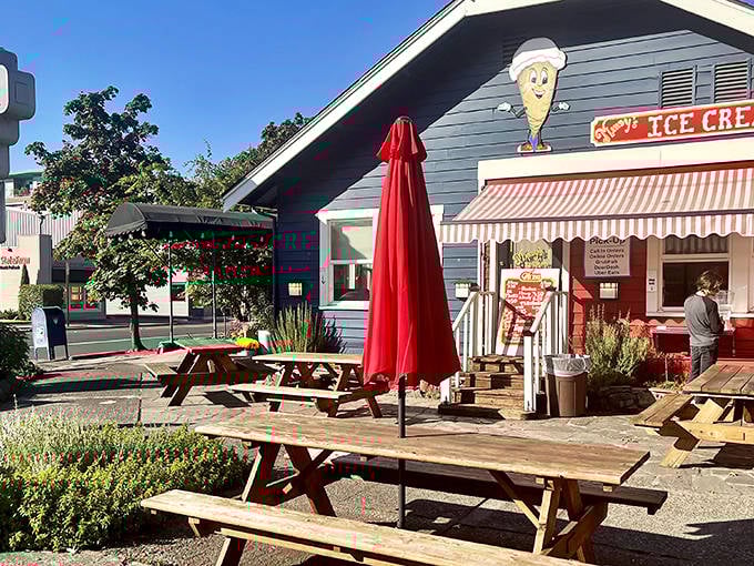 Picnic tables await hungry diners under the watchful eye of that iconic ice cream cone. Outdoor dining with a side of Eugene charm.