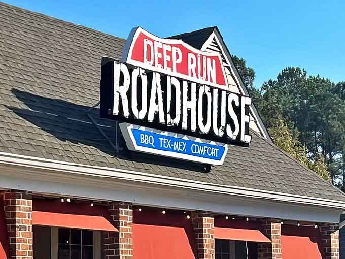 The welcoming storefront of Deep Run Roadhouse proudly announces its triple threat of BBQ, Tex-Mex, and comfort food delights.