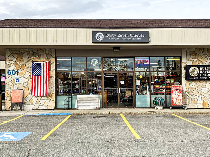 The unassuming exterior of Rusty Raven Uniques hides a wonderland of treasures within. That American flag isn't just decoration&mdash;it's a promise of authentic Americana inside.