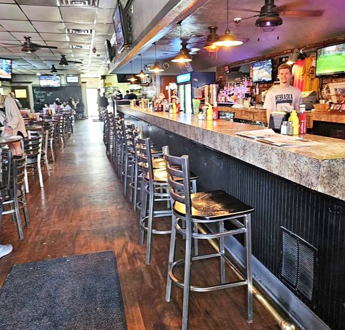 The bar at Dinker's isn't just where drinks are served; it's where strangers become friends and regulars become family.