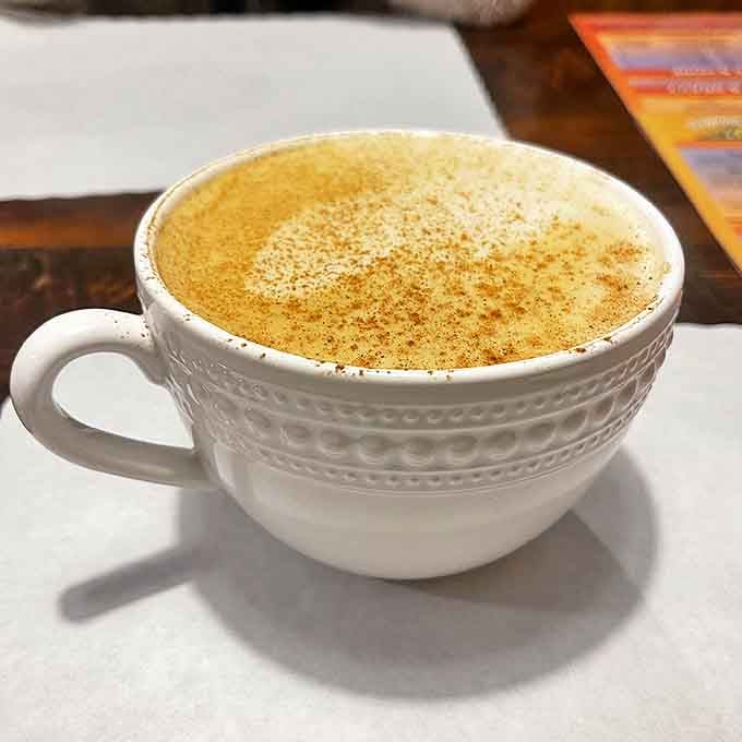 This isn't just coffee—it's a warm embrace in a mug, dusted with cinnamon that whispers, "The day's going to be just fine."