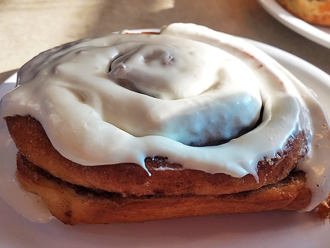 This cinnamon roll isn't just breakfast &ndash; it's dessert masquerading as a morning meal. The icing has its own gravitational pull.