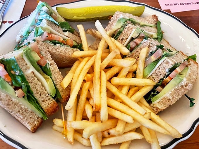 The club sandwich &ndash; architecture you can eat! Triple-decker construction with crisp vegetables and savory meats, engineering you can taste.