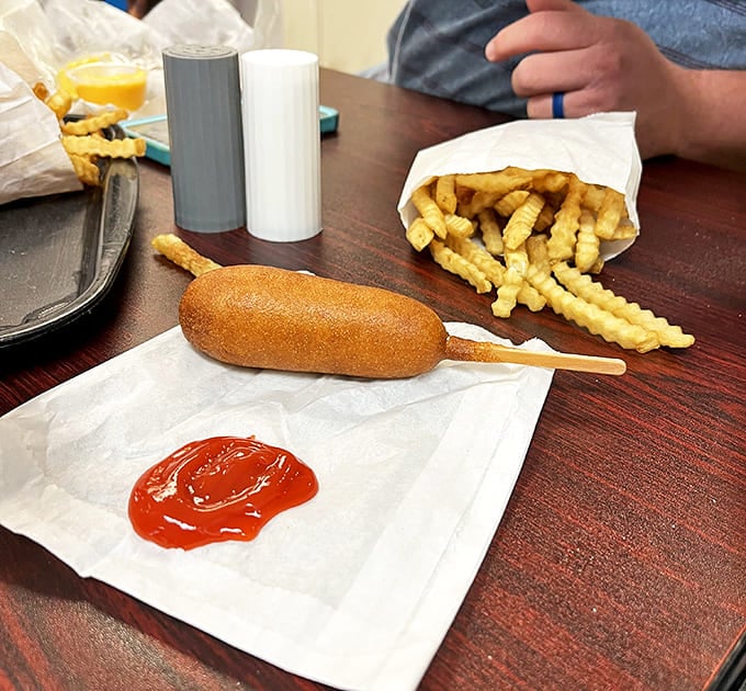 The humble corn dog, elevated to roadside royalty. One bite through that crispy exterior takes you straight back to your best childhood summer memories.