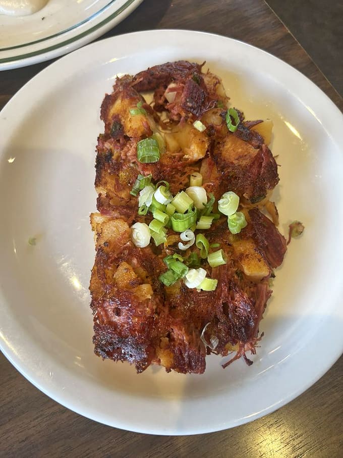 Corned beef hash with green onions&mdash;a breakfast rebellion against boring morning food that deserves a standing ovation.