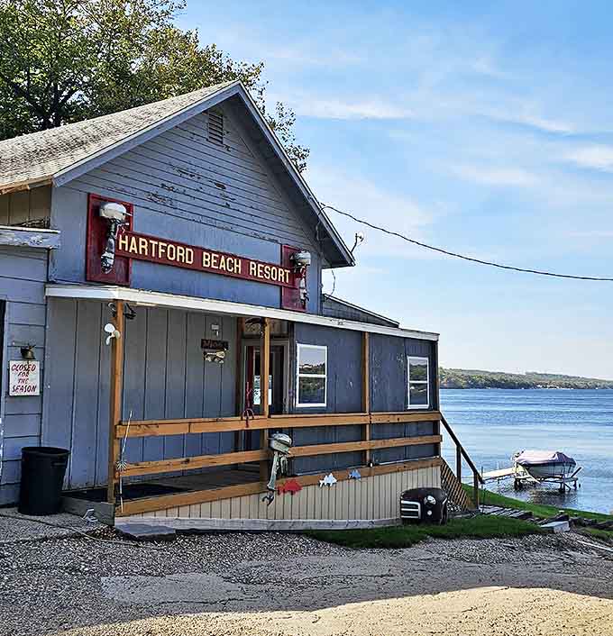 The Hartford Beach Resort sign serves as both historical marker and reminder that lakeside relaxation never goes out of style.