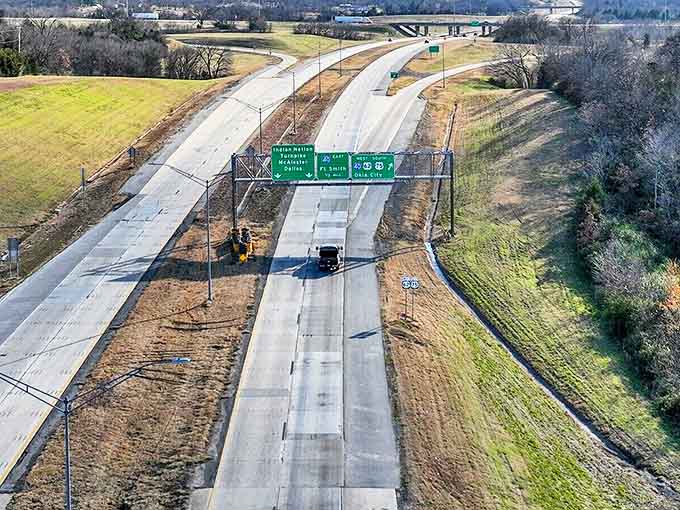 Highway signs point to nearby cities, but the real destination might be the journey through eastern Oklahoma's gently rolling countryside.