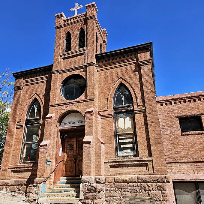 Holy Family Church reaches skyward with brick-and-mortar faith, a spiritual anchor in a town that once had more saloons than sanctuaries.