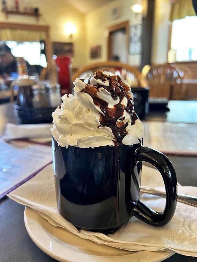 Hot chocolate that doesn't come from a packet, topped with a mountain of whipped cream and chocolate drizzle&mdash;winter's perfect consolation prize.