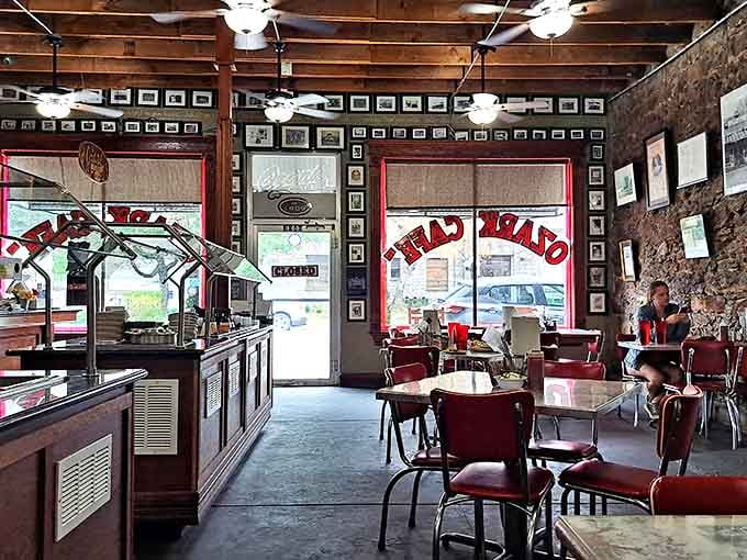 Red chairs against exposed brick walls create the classic diner atmosphere where memories are made. The counter service area promises efficiency without sacrificing charm.