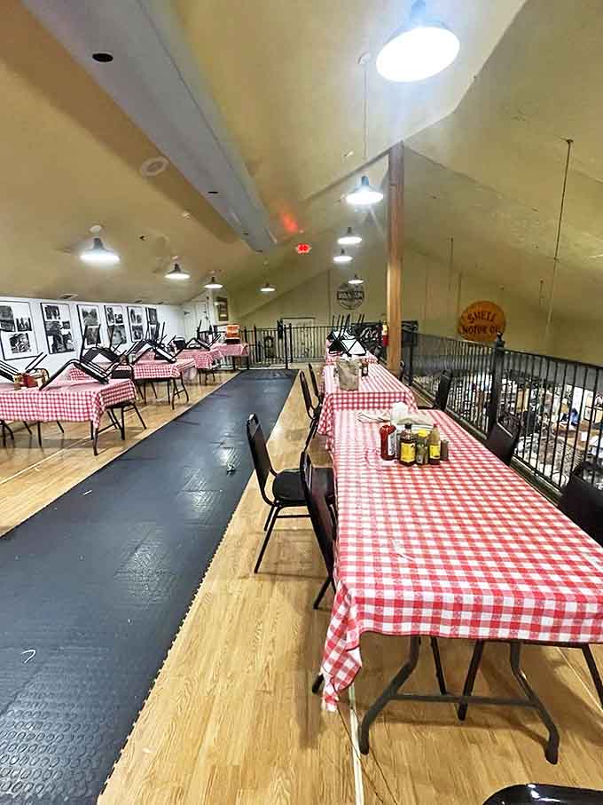 Red-checkered tablecloths and family-style seating create the perfect backdrop for the kind of meal that turns strangers into friends over second helpings.