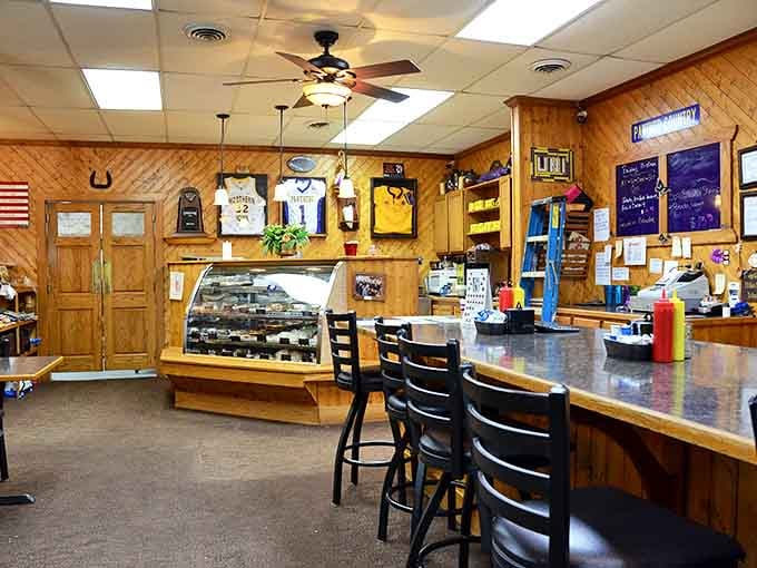 The counter where breakfast magic happens. Sports memorabilia and local pride decorate walls that have witnessed countless coffee refills.
