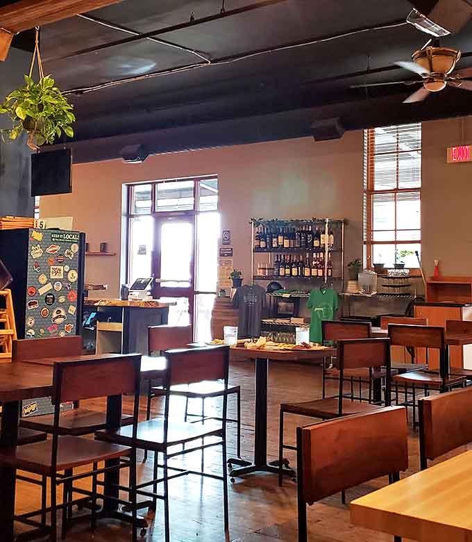 The dining area invites lingering conversations and second rounds&mdash;where industrial elements meet warm woods in perfect harmony.