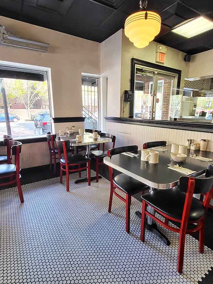 Morning light streams through windows onto classic diner tables, where countless conversations and coffee refills have marked the rhythm of Boston days.