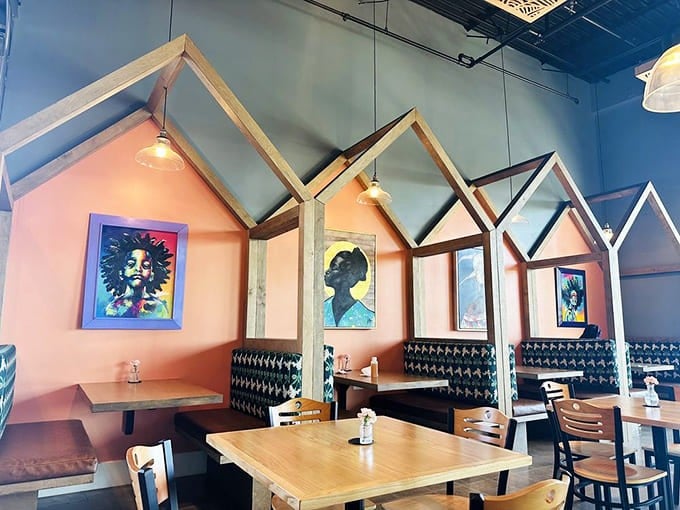 These house-shaped booths aren't just Instagram-worthy&mdash;they're comfort zones where food memories are made. The colorful artwork adds just the right splash of personality.