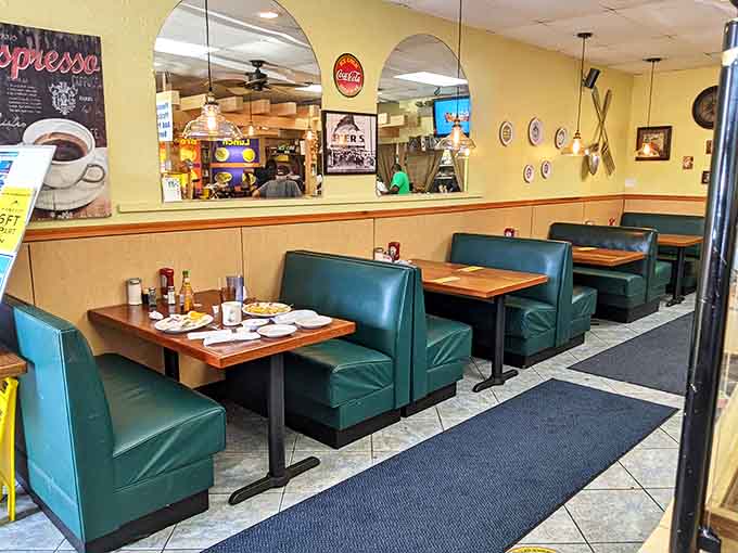 Classic diner booths in teal vinyl&mdash;where countless Florida mornings have started with coffee and ended with clean plates.