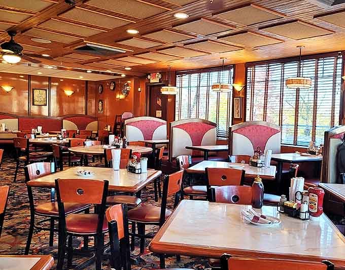 The warm wood ceiling and classic booth setup &ndash; where strangers become neighbors and neighbors become friends over bottomless coffee.