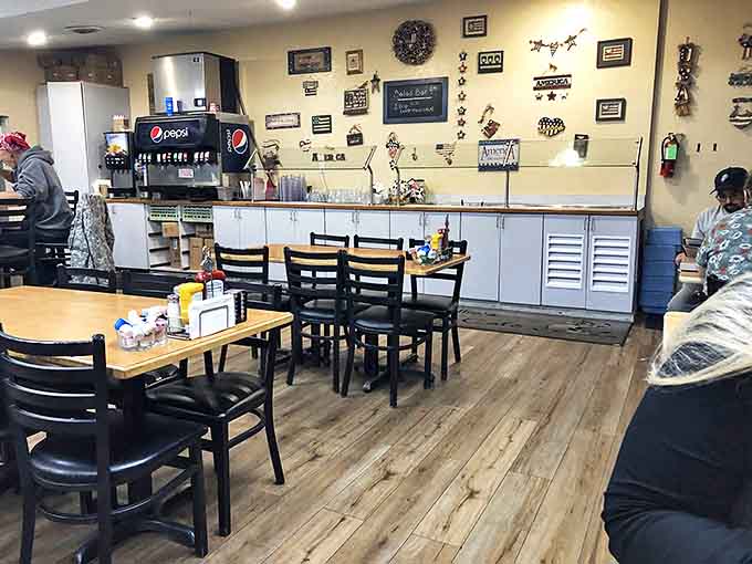 Warm wood tones, comfortable seating, and farm-themed decor create the perfect backdrop for conversations that flow as easily as the coffee refills.