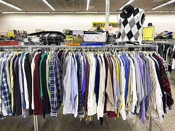 Men's shirts lined up like soldiers ready for inspection. That argyle vest is practically begging for a second chance at life.