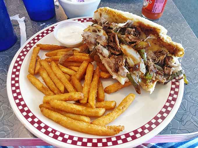 This Philly steak sandwich isn't messing around. Those fries aren't just sides&mdash;they're supporting actors in a delicious drama starring thinly-sliced beef.