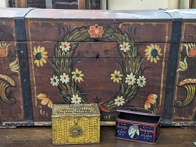 This hand-painted trunk didn't just store possessions—it stored dreams. The floral detailing speaks of an era when even utilitarian objects deserved artistic attention.