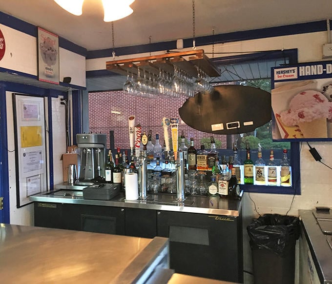 The bar area isn't trying to be trendy or Instagram-worthy—it's perfected the art of serving exactly what you want, exactly how you want it.