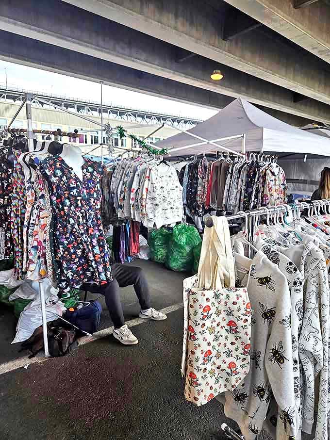 Beneath concrete overhangs, vintage clothing finds new life. That floral dress might have stories to tell!